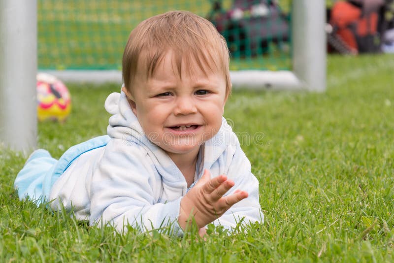 Little Boy Playing on the Football Field with Gates Stock Image - Image ...