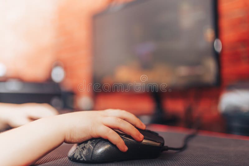 Little Boy Playing Games on Computer in Headphones with Microphone ...