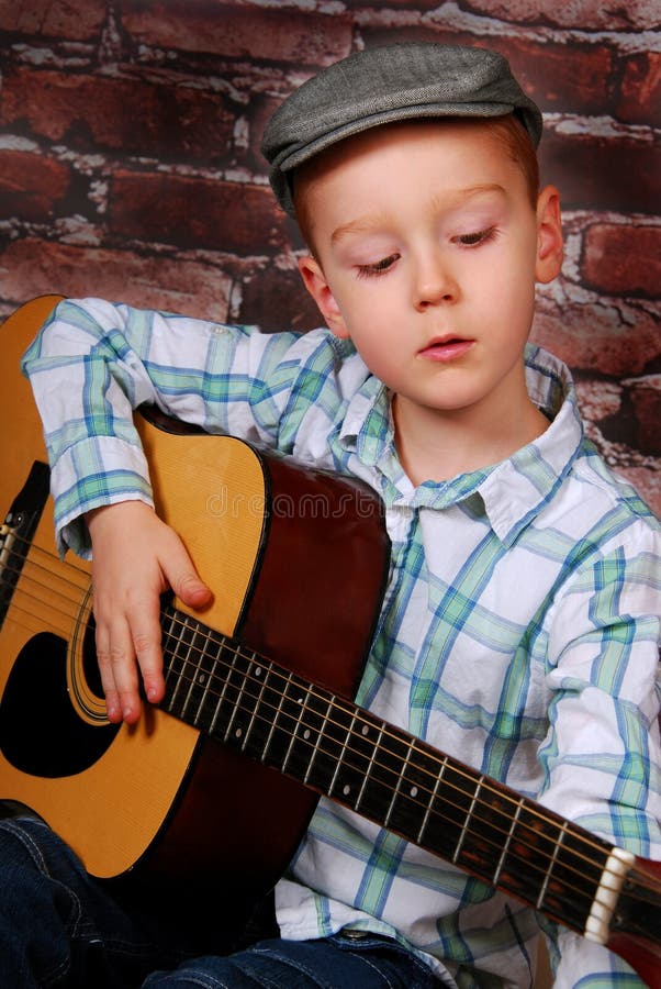 Little boy playing guitar stock image. Image of music - 28384847