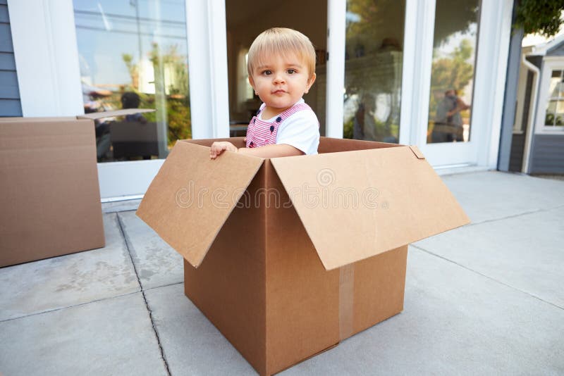 Little Boy Playing Inside Moving in Box Stock Photo - Image of hiding ...