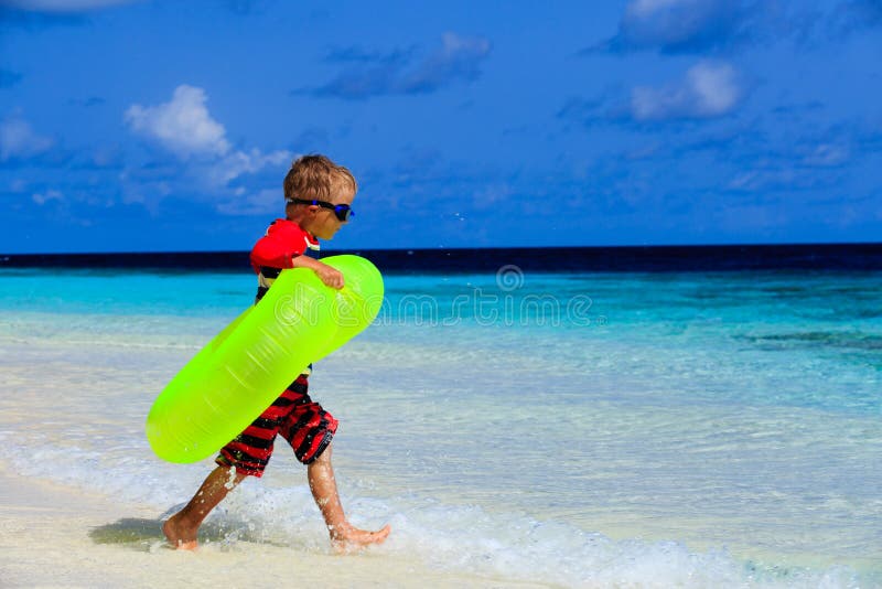 Little Boy Playing with Life Ring at Tropical Stock Image - Image of ...