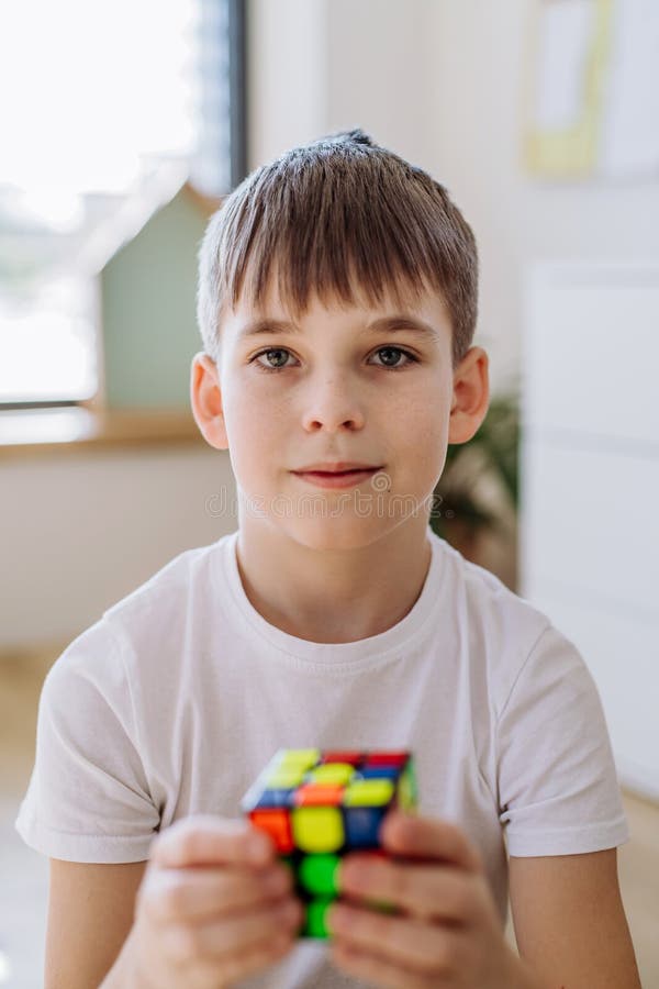 Little Boy Playing with Logic Cube in His Room. Editorial Photography ...