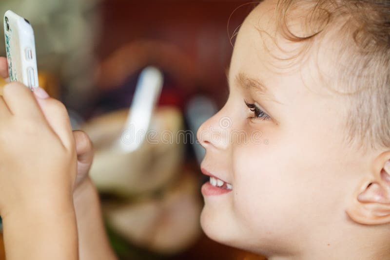 Little Boy Playing Mobile Phone with Smile Stock Photo - Image of game ...