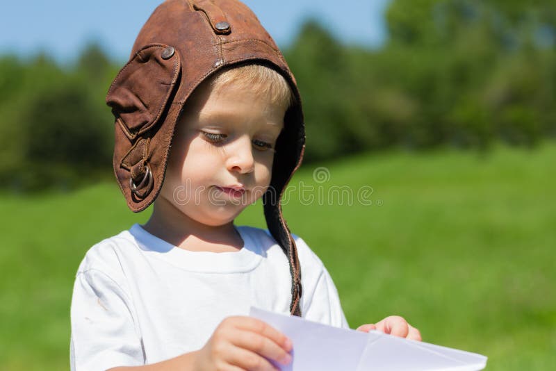 Little Boy Playing Paper Plane Stock Image - Image of vacation, dream ...