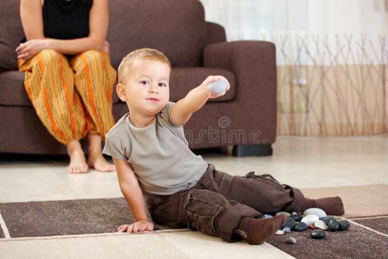 Little Boy Playing with Pebbles Stock Image - Image of adorable, infant ...