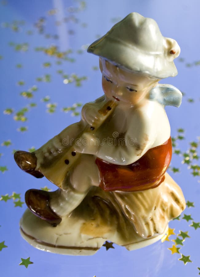Little Boy Playing Pipe Statuette Stock Image - Image of boot, mold ...