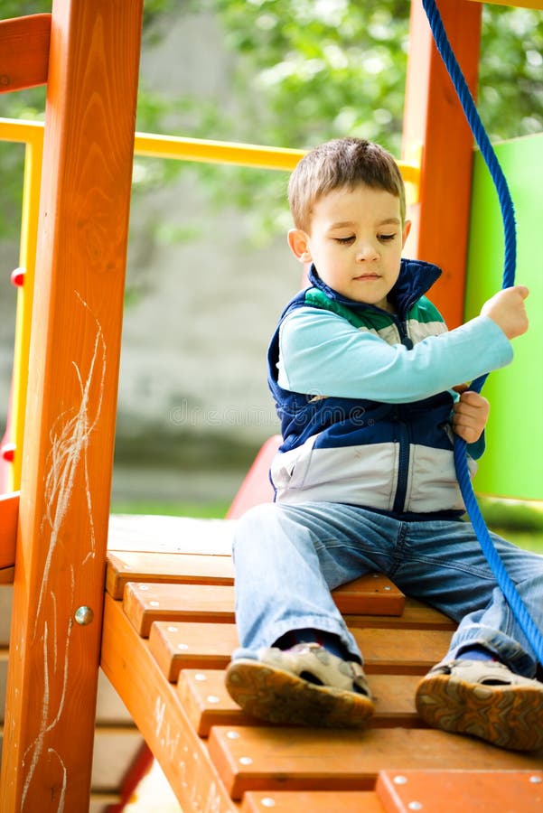 Little Boy is Playing on Playground Stock Image - Image of green ...