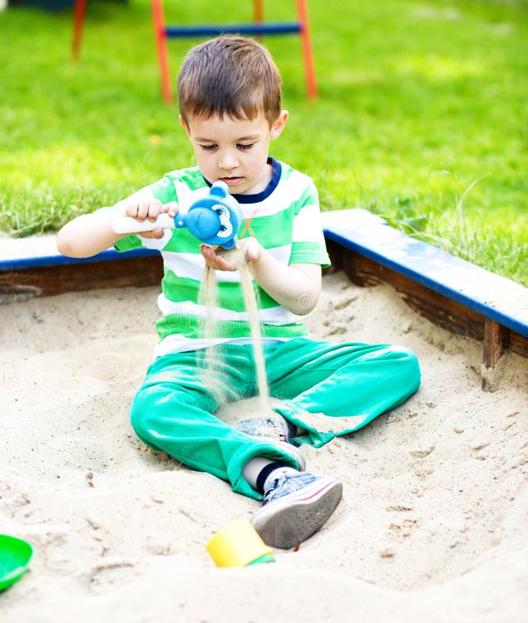 Little Boy is Playing on Playground Stock Photo - Image of brunette ...