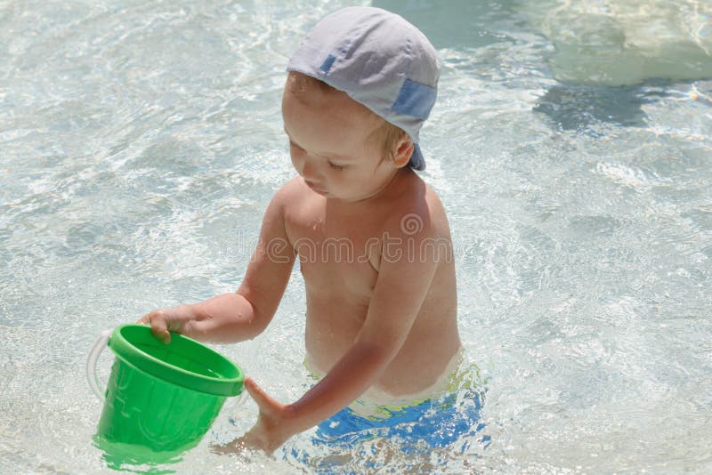 Little Boy Playing in the Pool Stock Image - Image of little, joyful ...
