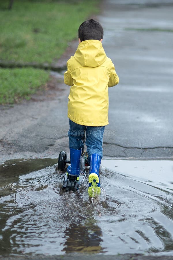 Little Boy Playing in Puddle Stock Photo - Image of child, dirt: 116706134