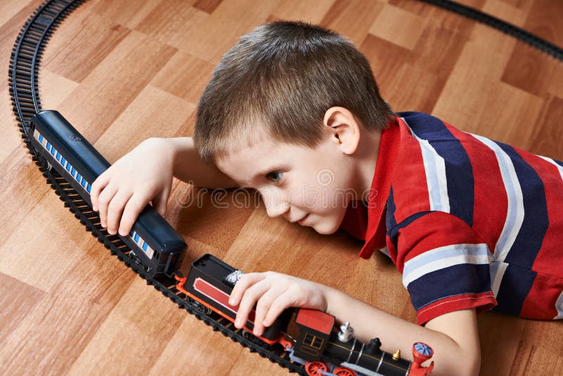 Little Boy Playing with Railway Stock Photo - Image of railroad, indoor ...