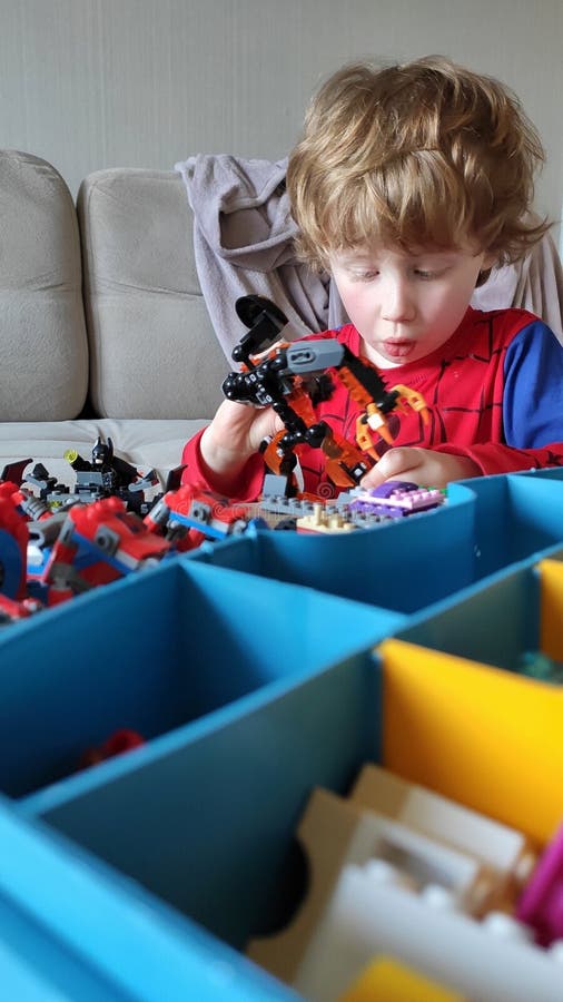 Little Boy Playing with Robot Stock Photo - Image of face, toddler ...