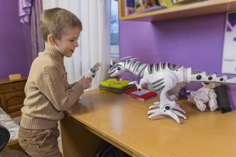 Little Boy Playing with Robots Stock Image - Image of colorful ...
