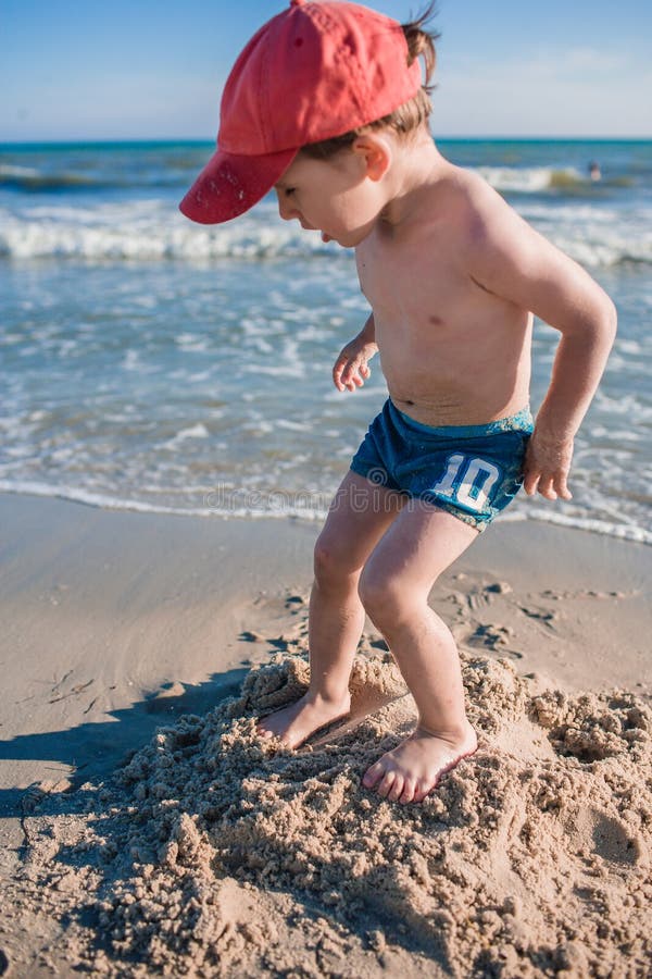 Little Boy Playing on the Seashore Stock Image - Image of beach ...