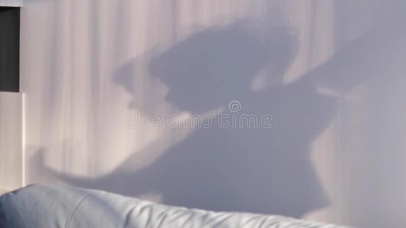 Defocus Little Boy Playing with Shadows on the Wall. Shadow of a ...