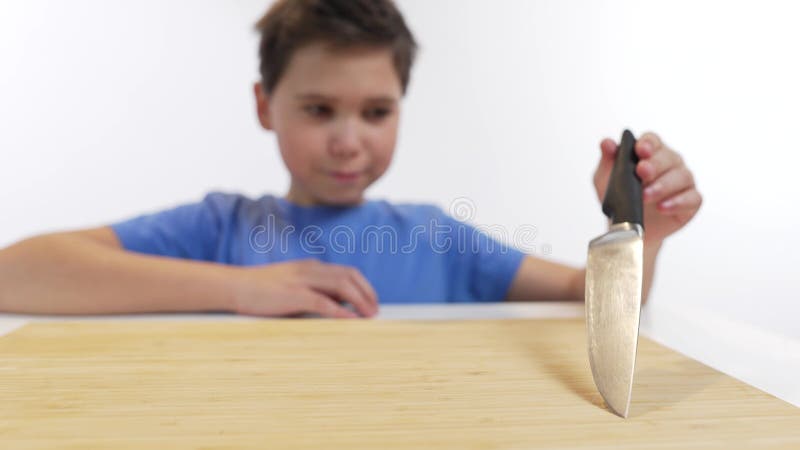 Little Boy Playing with a Sharp Knife Stock Video - Video of housework ...