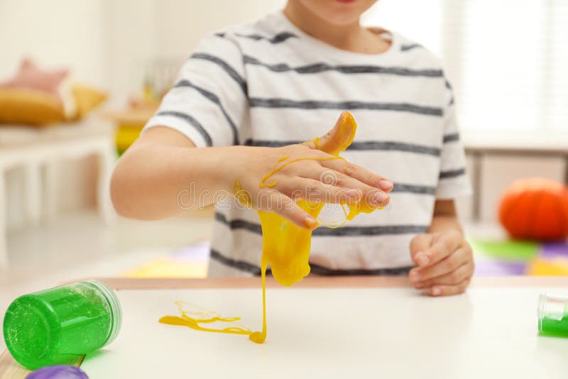 Little Boy Playing with Slime at Table Indoors Stock Photo - Image of ...