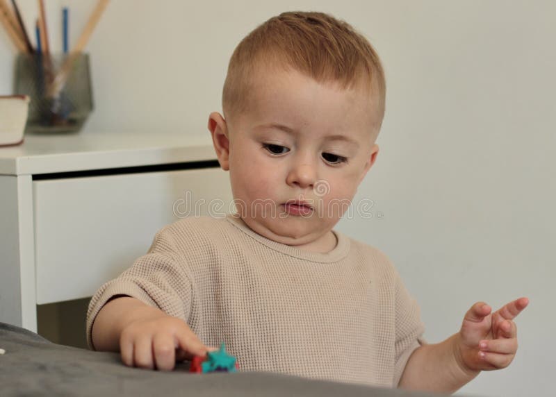 A Little Boy is Playing with a Small Toy Car. Stock Image - Image of ...