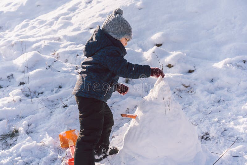 Little Boy Playing with Snow. Winter Holiday Stock Photo - Image of ...