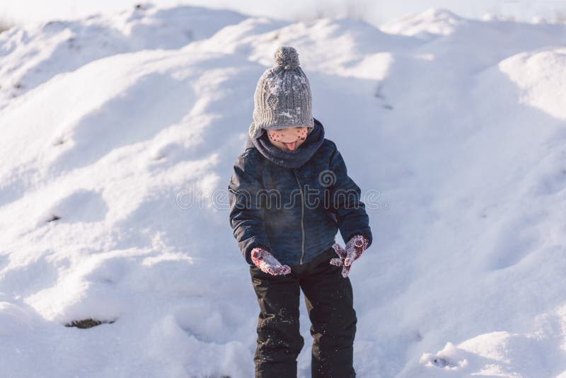 Little Boy Playing with Snow. Winter Holiday Stock Image - Image of ...