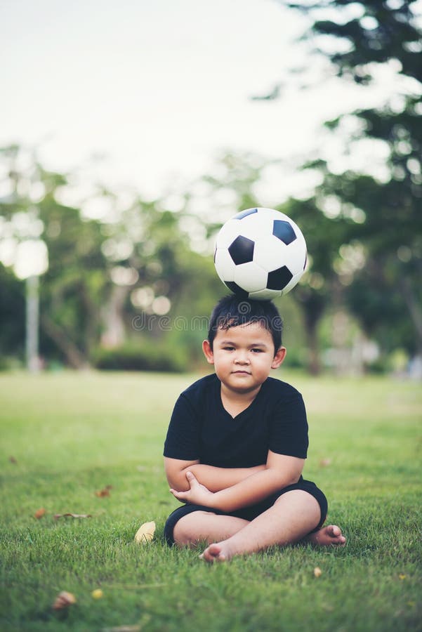 Little Boy Playing Football Stock Photo - Image of little, playing ...