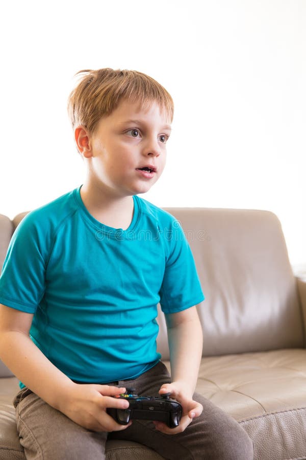 Boy playing video games stock image. Image of leisure - 245506015