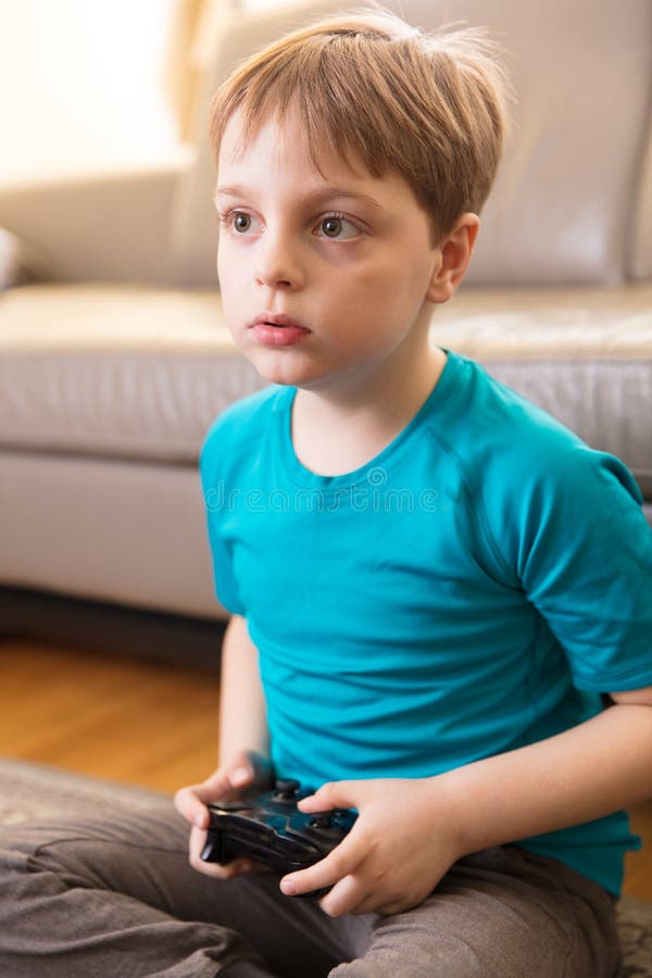 Boy playing video games stock photo. Image of preschooler - 245506098