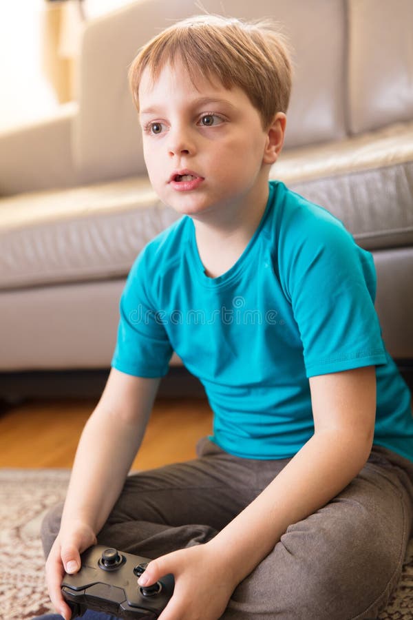 Boy playing video games stock photo. Image of game, joystick - 245506106