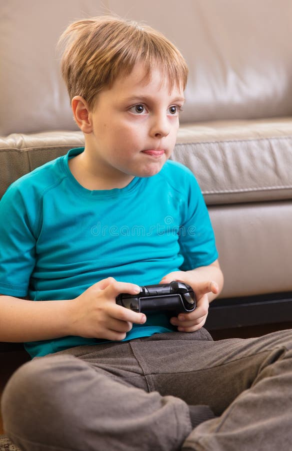 Boy playing video games stock photo. Image of child - 245506154