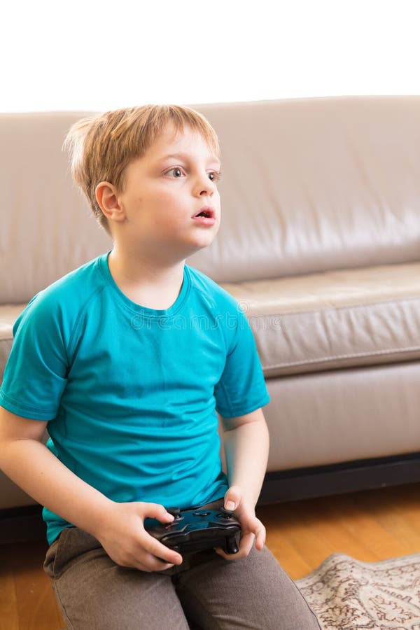 Boy playing video games stock photo. Image of cute, expressing - 245506230