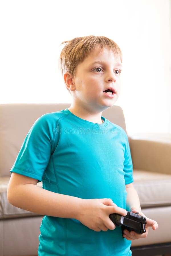Boy playing video games stock photo. Image of preschooler - 245506248