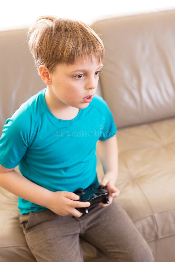 Boy playing video games stock photo. Image of pleasure - 245506360