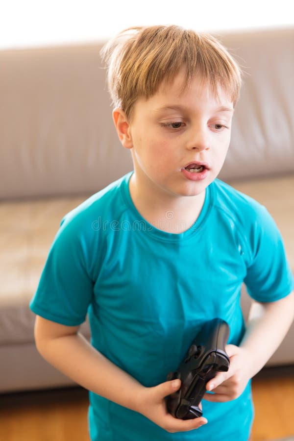 Boy playing video games stock image. Image of cute, childhood - 245506391
