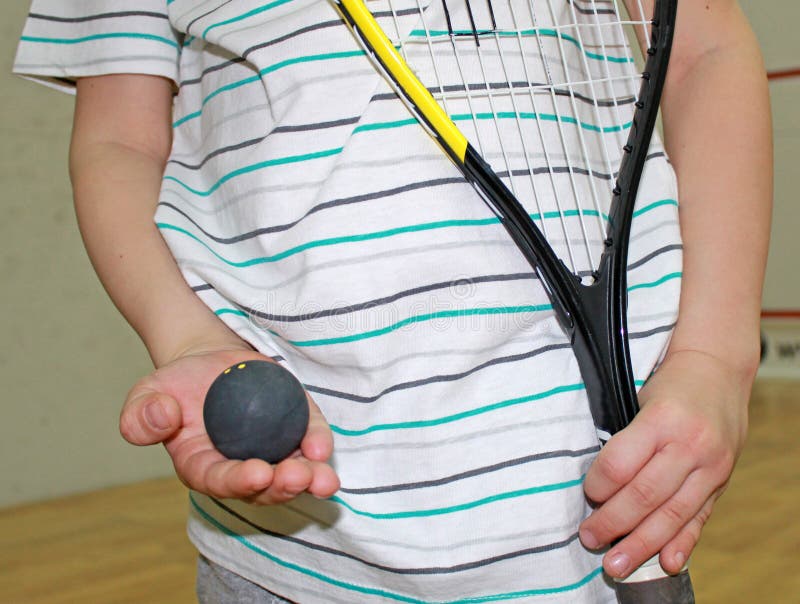 Little boy playing squash stock image. Image of stands - 51954607
