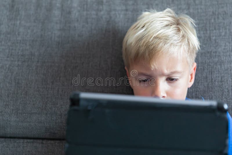 Little Boy Playing on Tablet Stock Image - Image of afraid, educational ...