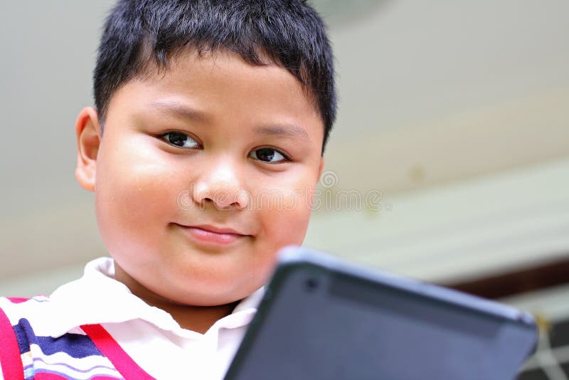 Little Boy playing Tablet stock image. Image of computer - 32478499