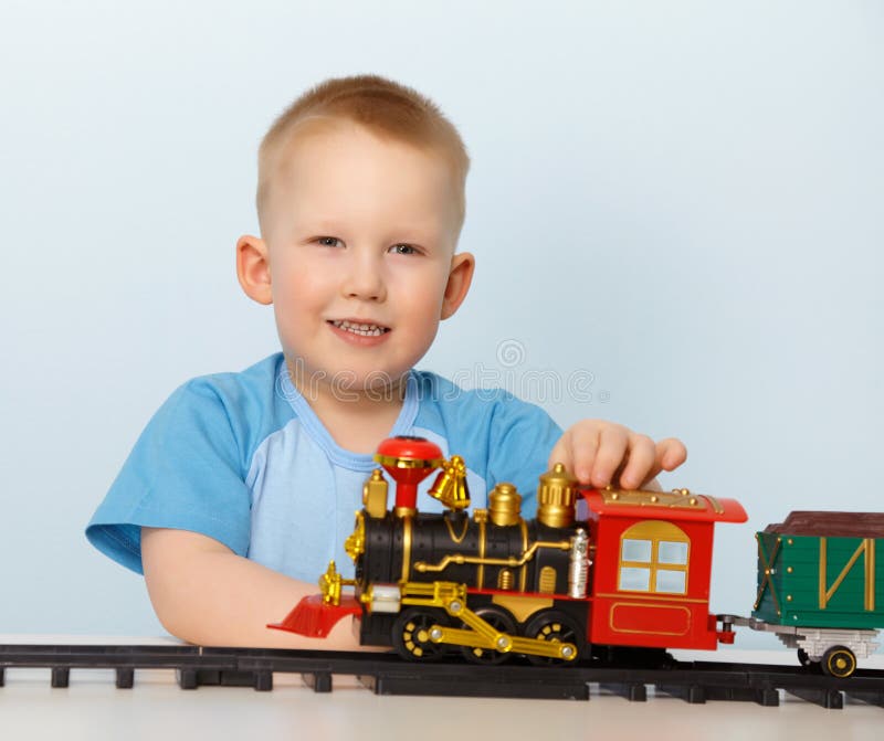 Little Boy Playing with a Toy Locomotive Stock Photo - Image of small ...