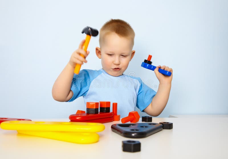 Little Boy Playing with Color Toys on Floor Stock Photo - Image of ...
