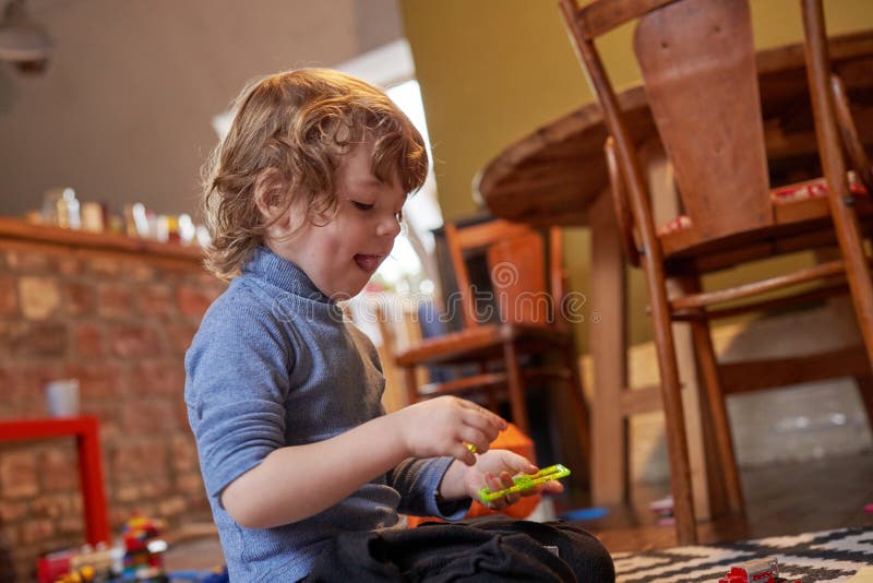 Little Boy is Playing with Toys in the Room Stock Photo - Image of ...