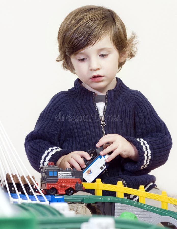 Little Boy Playing with Train Set Stock Photo - Image of creativity ...