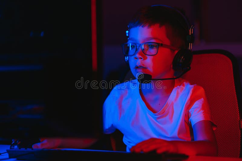 Little Boy Playing Video Game in the Dark Room Stock Image - Image of ...
