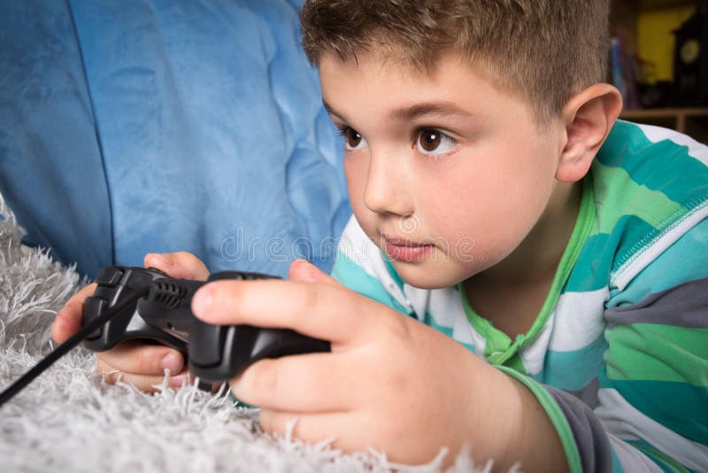 Little Boy Playing Video Games Stock Photo - Image of child, playful ...