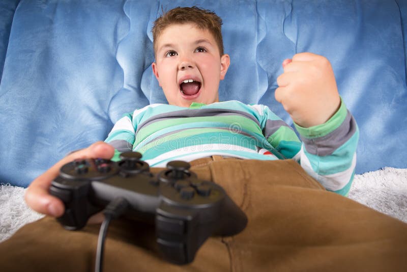 Little Boy Playing Video Games Stock Photo - Image of happy, emotion ...