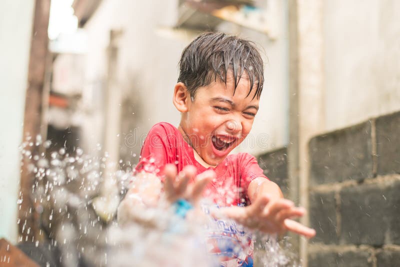 Little Boy Playing Water Splash Over Face Stock Photo - Image of nature ...