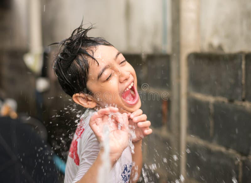 Little Boy Playing Water Splash Over Face Stock Photo - Image of splash ...