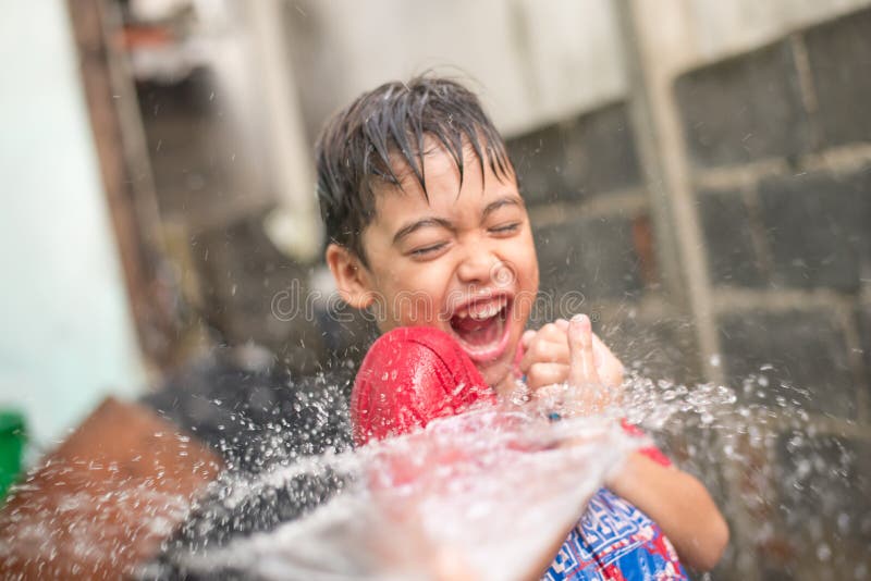 Little Boy Playing Water Splash Over Face Stock Image - Image of ...