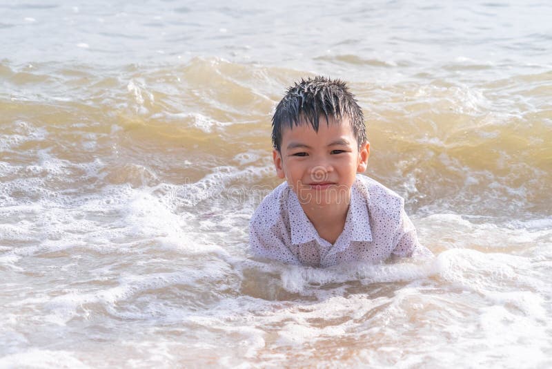 Little Boy Playing with Wave and Sand on Pattaya Beach Stock Photo ...