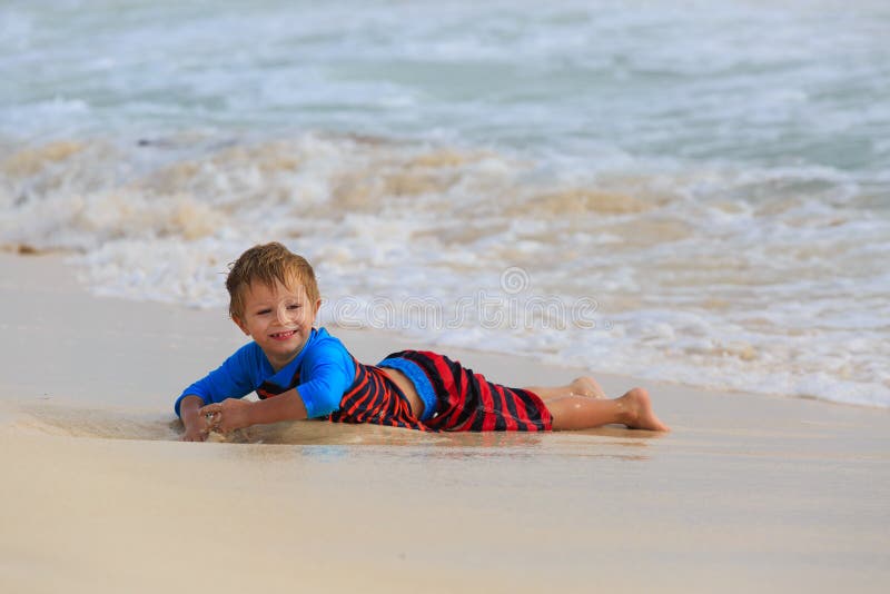 Little Boy Playing with Waves on Sand Beach Stock Photo - Image of ...