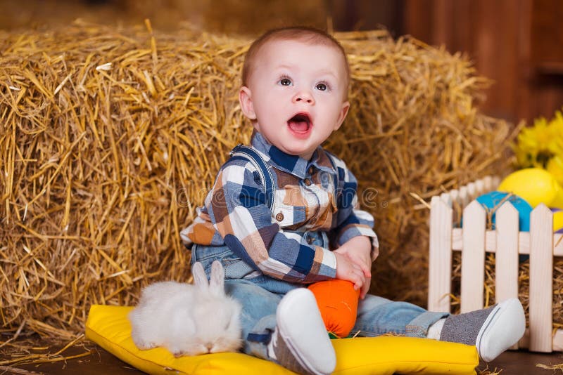 Little Boy Playing with White Rabbit Indoor. Spring Easter Fun for ...