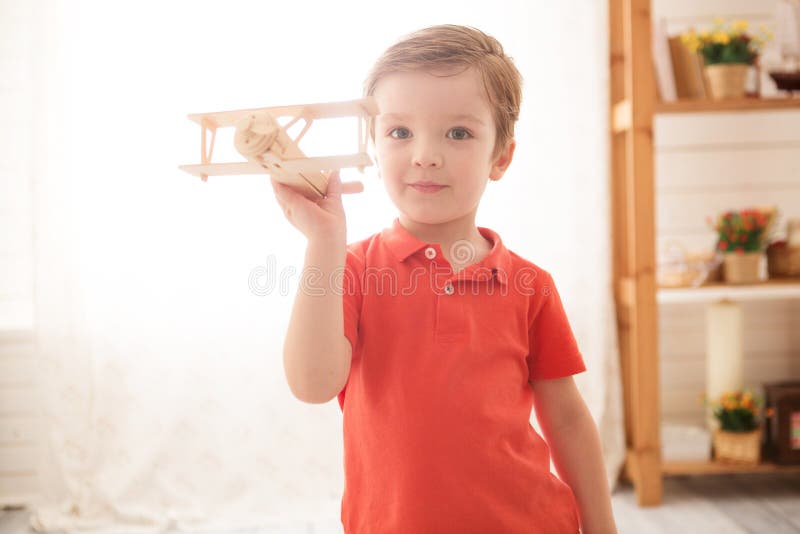 Little Boy Playing with Wooden Model Airplane Stock Photo - Image of ...